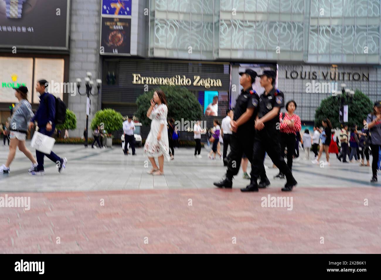 Chongqing, Chongqing Province, China, Asia, A police patrol walks ...