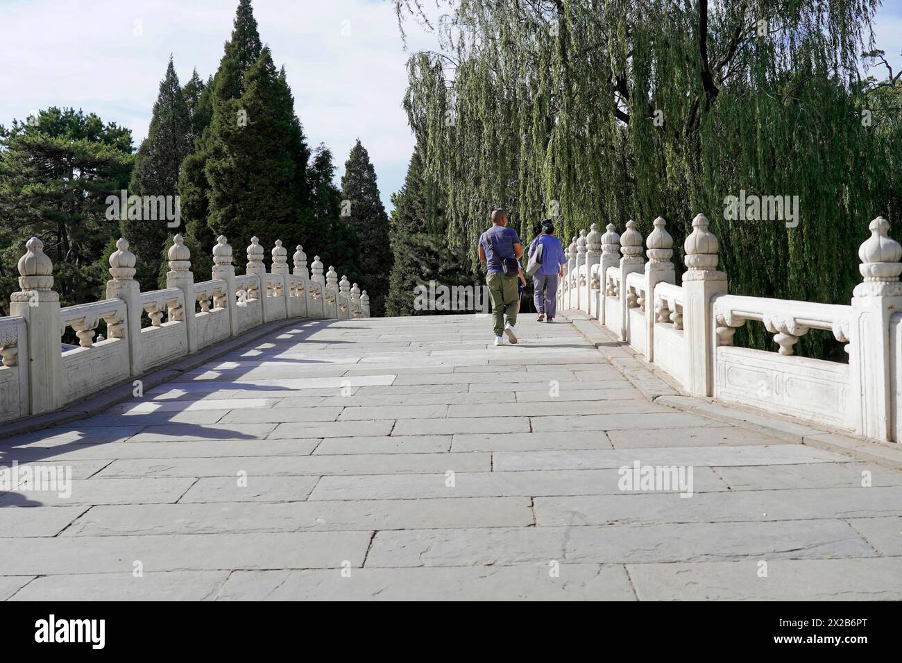 New Summer Palace, Beijing, China, Asia, Two people walking across a ...