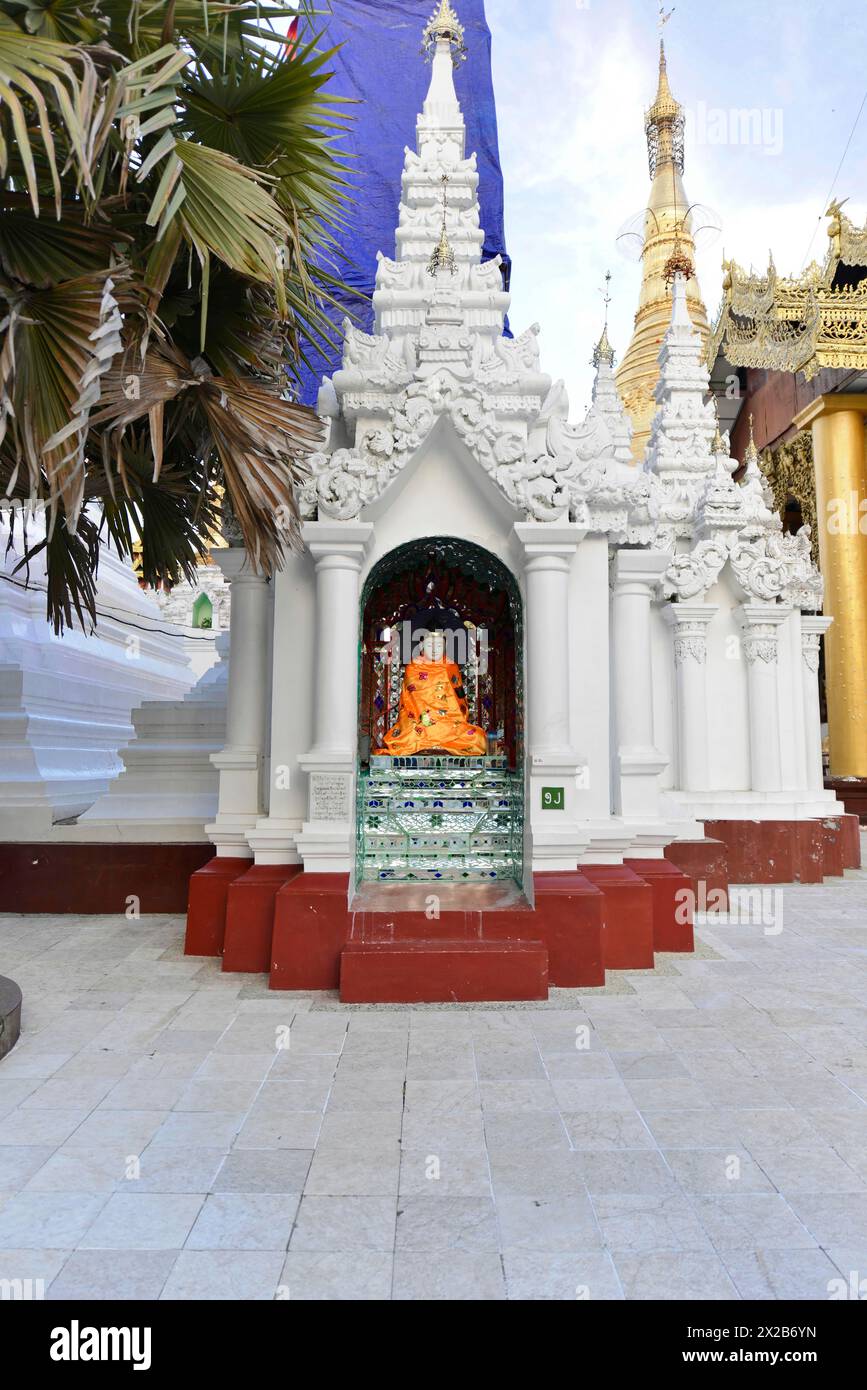 Shwedagon Pagoda, Yangon, Myanmar, Asia, Buddha statue in a niche with ...