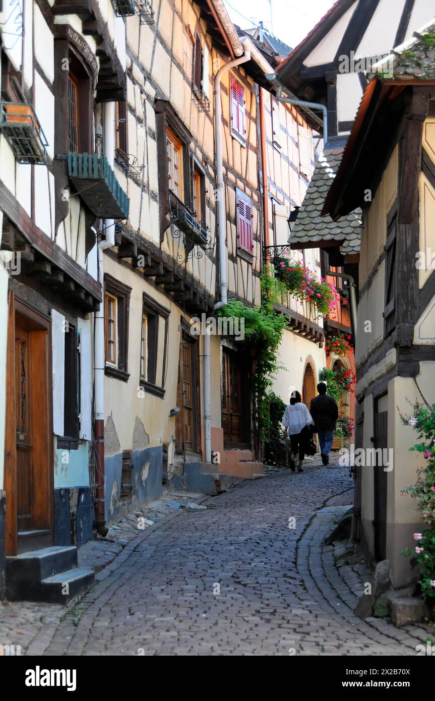 Eguisheim, Alsace, France, Europe, A winding alley with half-timbered ...