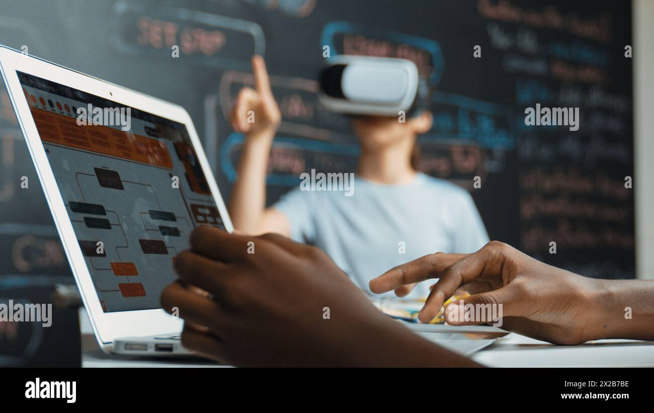 Closeup of african student hands coding or programing system at ...