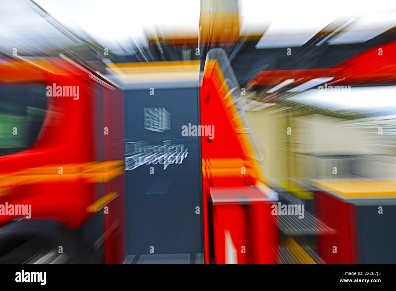 Close-up of a moving fire engine with coat of arms Stock Photo - Alamy