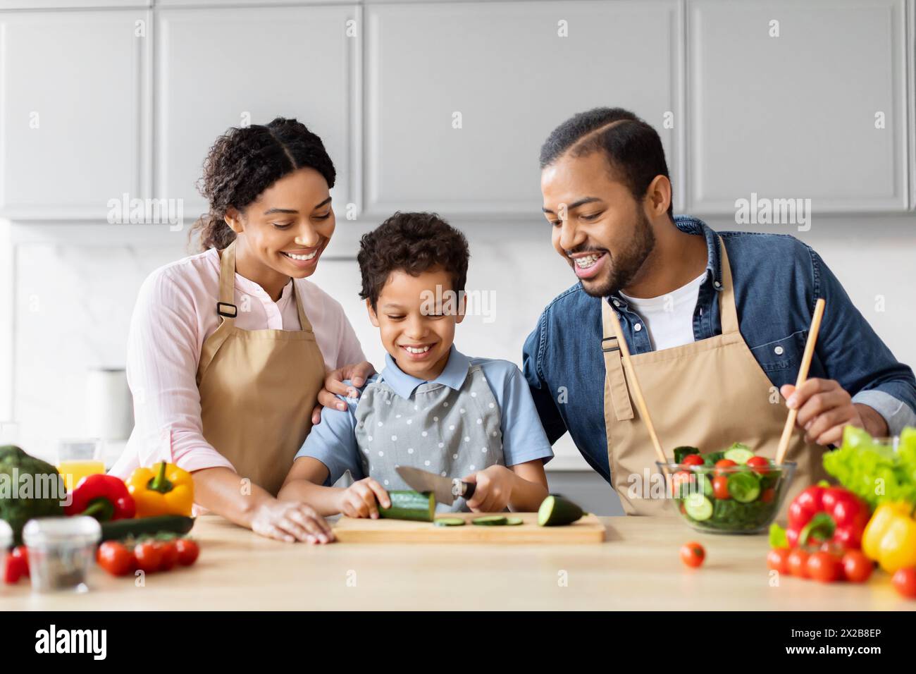 Black boy cooking in the kitchen hi-res stock photography and images ...