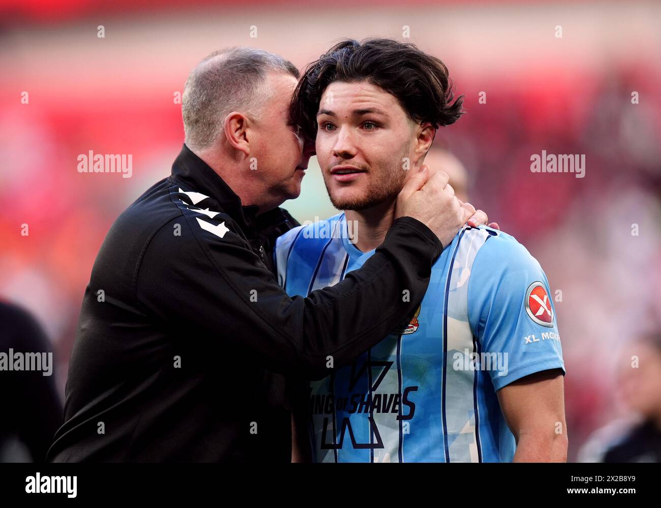 Coventry City manager Mark Robins consoles Callum O'Hare after the ...