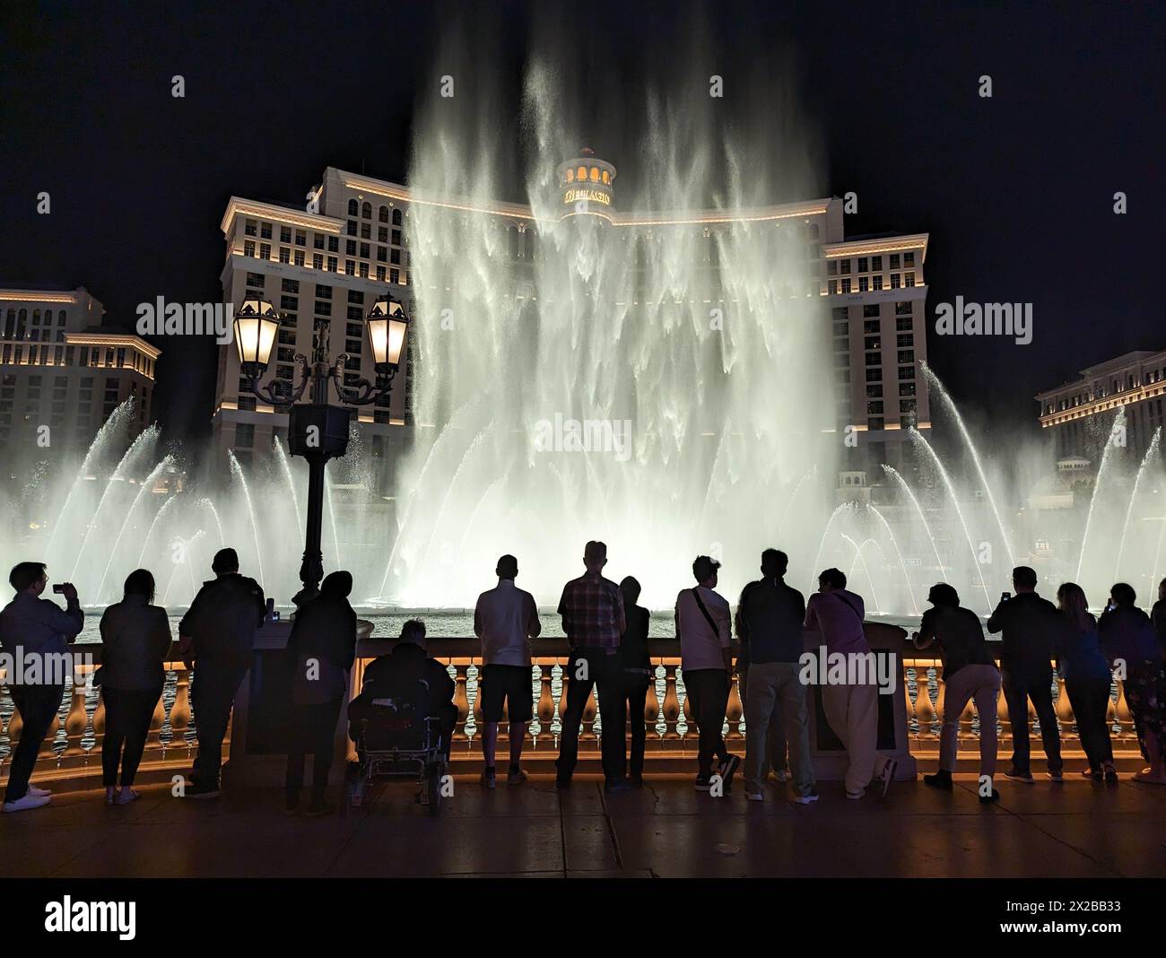 A crowd of people gather to watch the famous water fountain show in ...