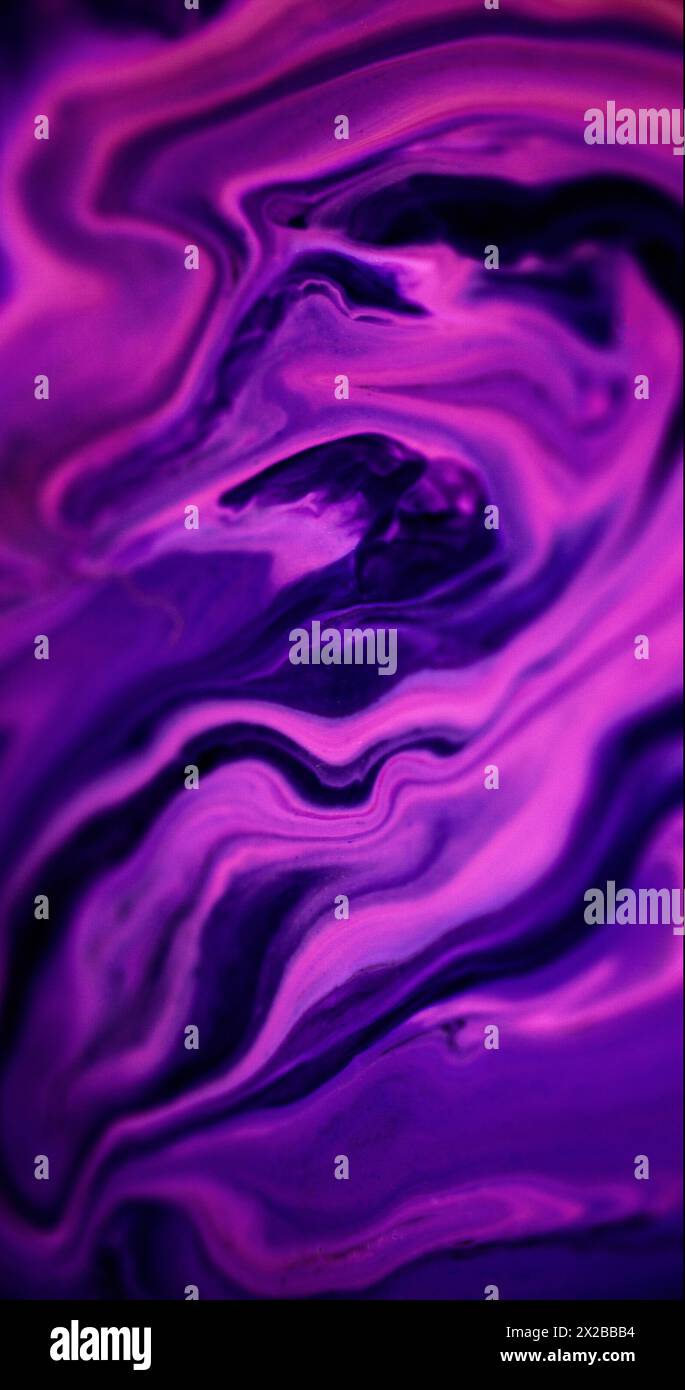 Liquid marble. Shimmering ink mix. Defocused neon pink purple black ...