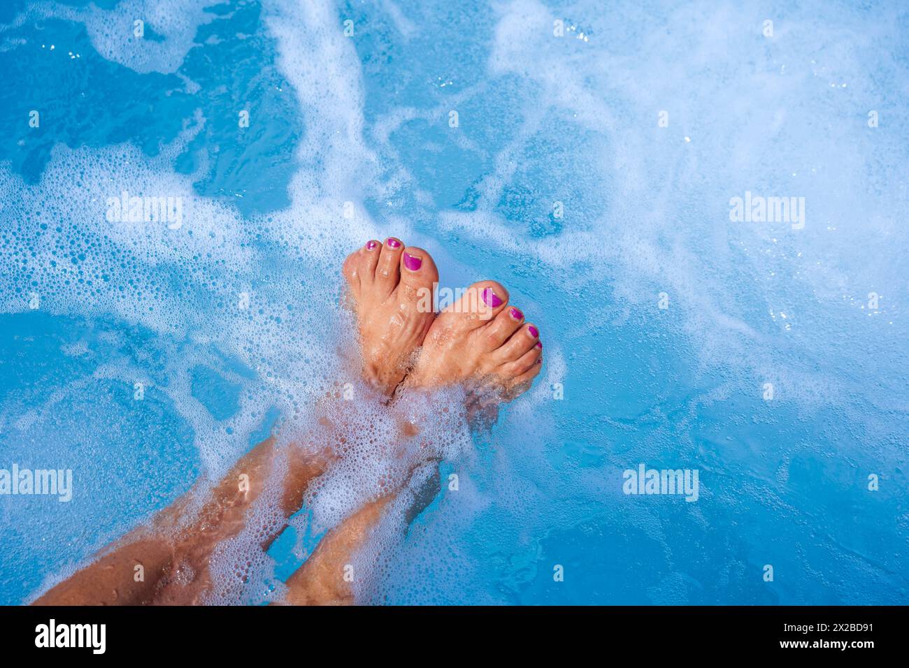 female legs in the jacuzzi of a vacation resort. Beauty treatment Stock ...