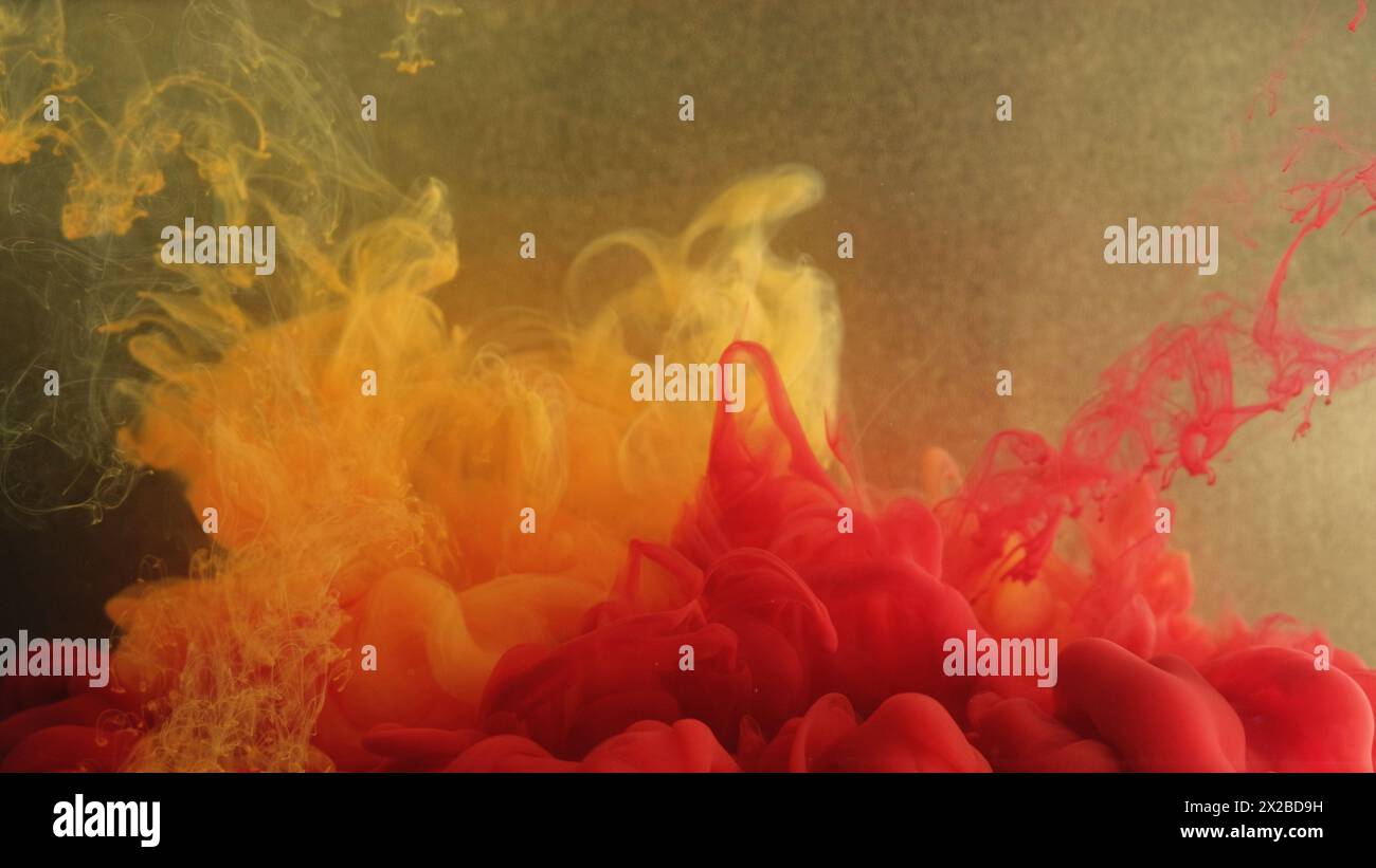 Color splash. Ink water explosion. Fantasy smoke. Bright red yellow ...