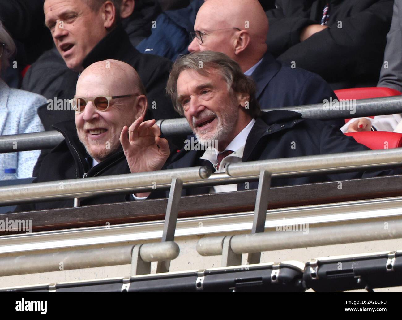 London, UK. 21st Apr, 2024. Avram Glazer and Sir Jim Ratcliffe enjoy a ...
