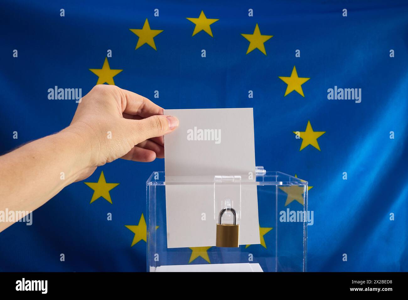 European Election Vote Concept. Hand placing a voting ballot into a ...