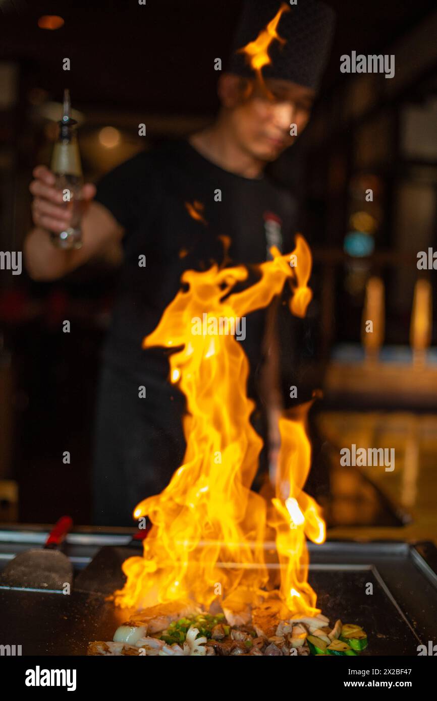 Berlin, Germany 08. 16. 2023. Teppanyaki chef cooking at teppan in a ...
