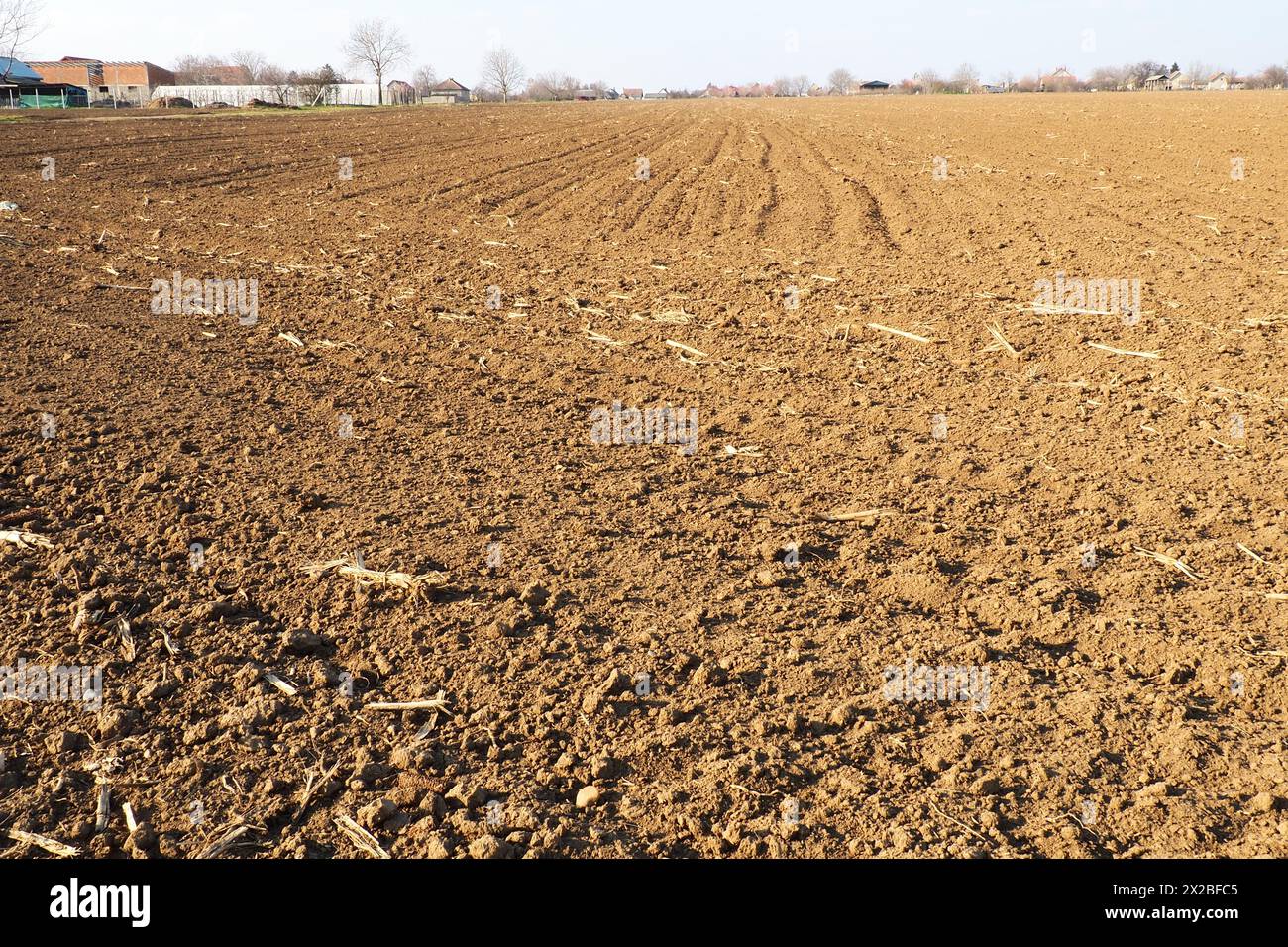 Arable field ready for spring agricultural work. Furrows from the ...