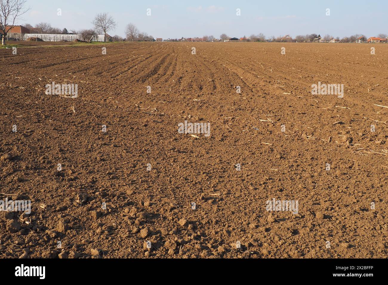 Arable field ready for spring agricultural work. Furrows from the ...