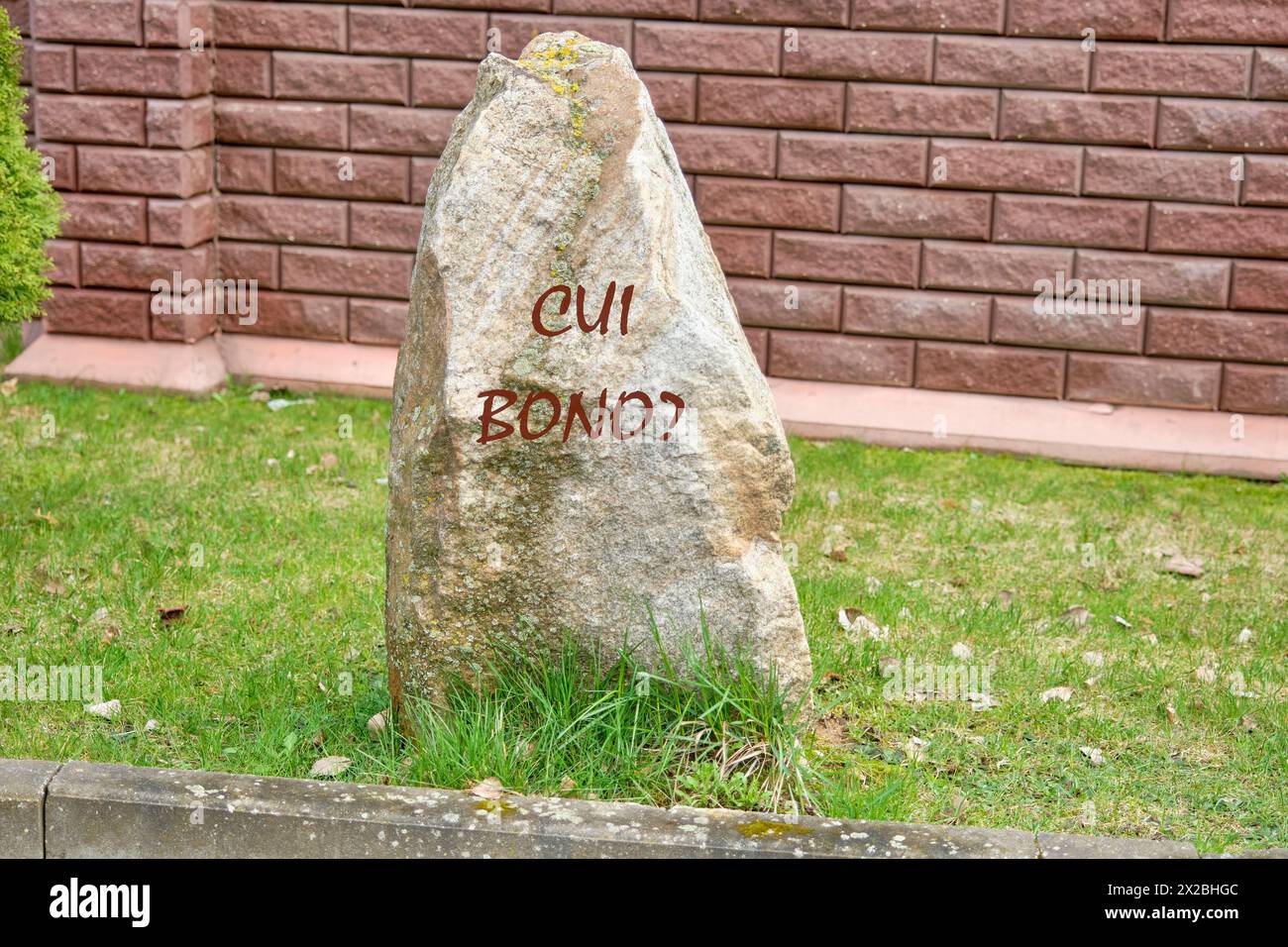 CUI BONO (to whose benefit) question on the stone near the fence on the ...