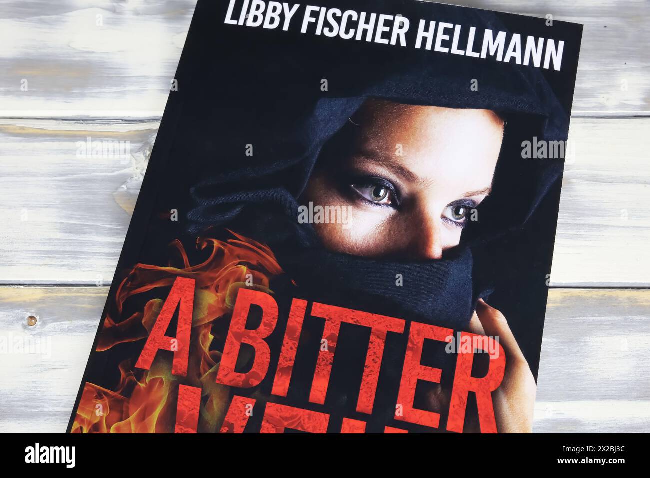 Viersen, Germany - April 9. 2024: Closeup of Libby Fischer Hellmann book cover A bitter Veil ...