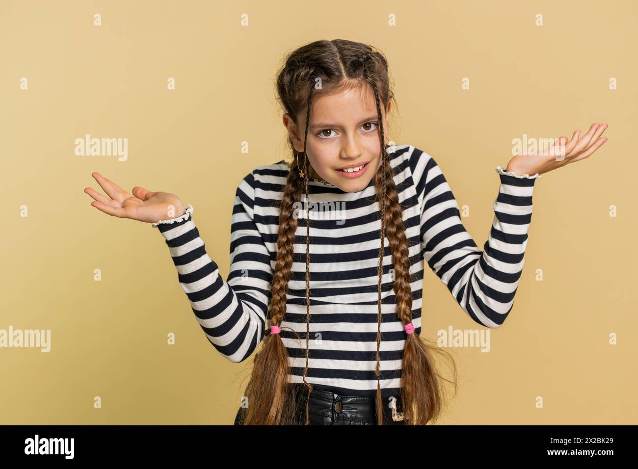 What. Why. Young school girl raising hands in indignant expression ...