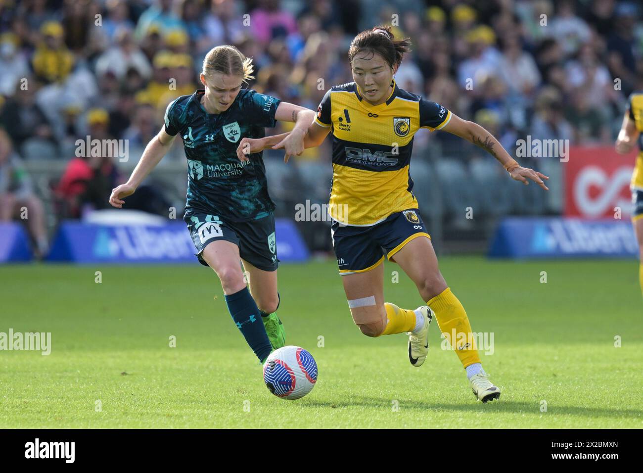 Gosford, Australia. 21st Apr, 2024. Abbey Rae Lemon (L) of Sydney FC ...