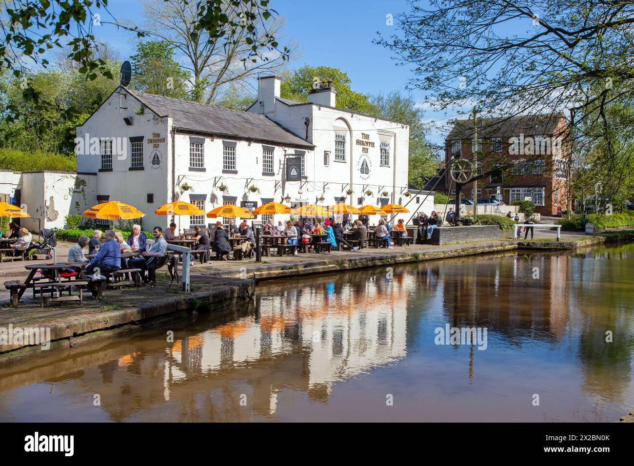 People sitting outside eating and drinking at the canalside pub the ...
