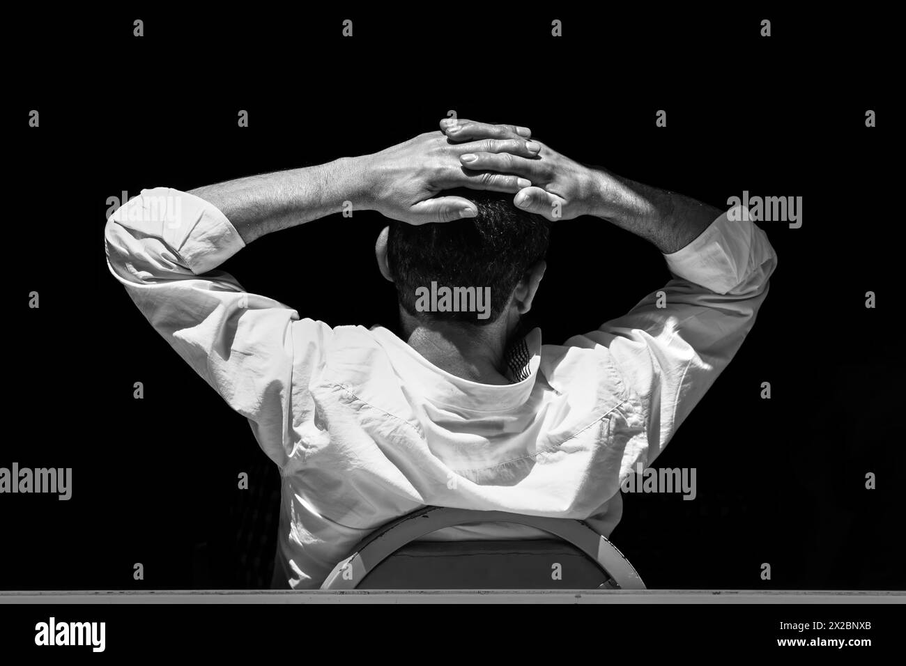 Folded hands behind back hi-res stock photography and images - Alamy