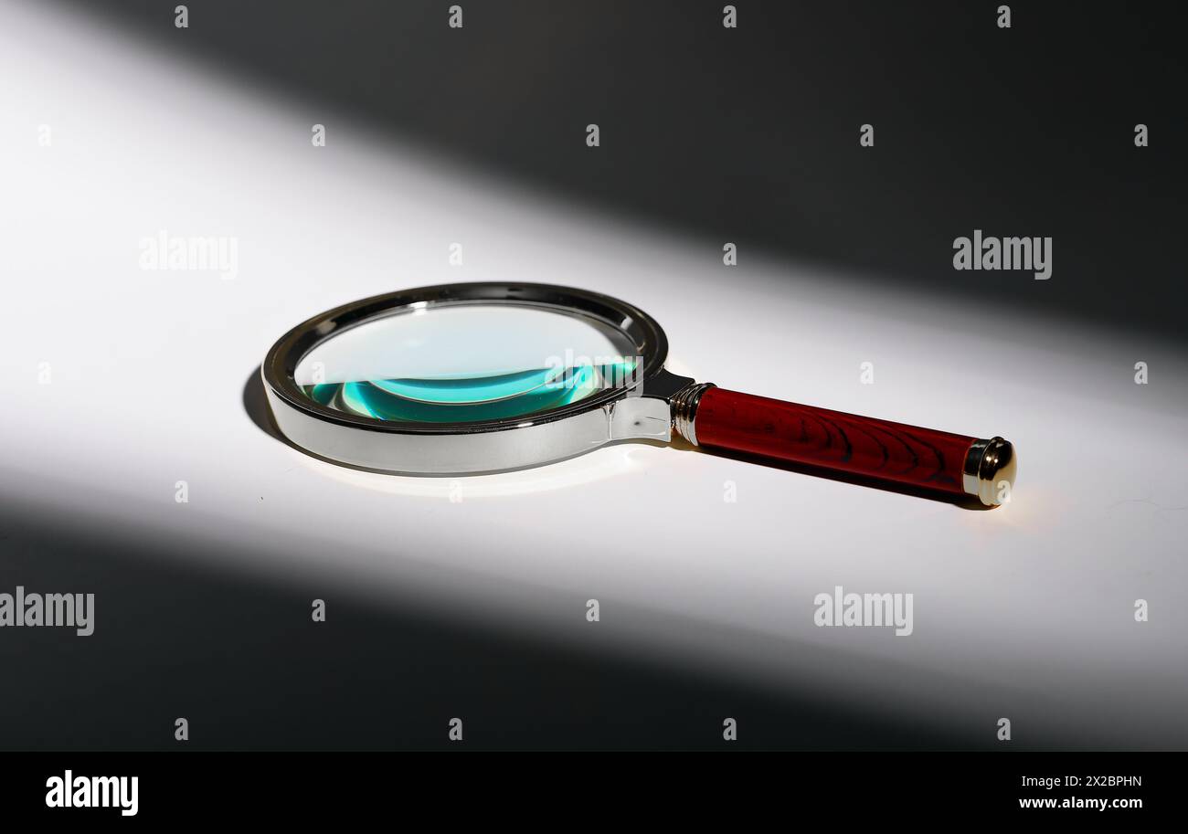 Vintage magnifying glass on shadow background. Minimal retro object ...