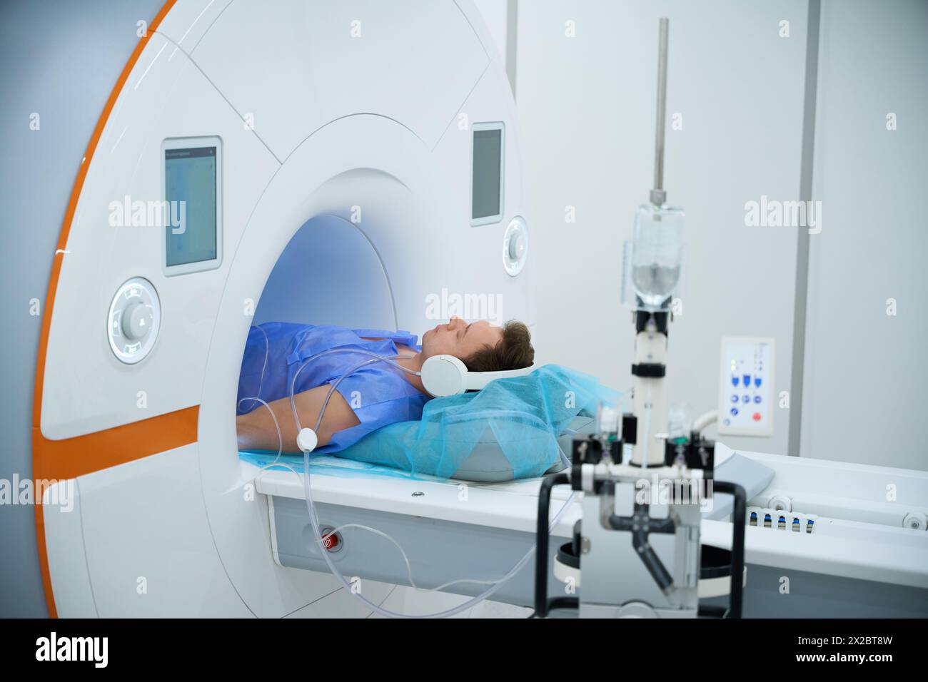 Patient undergoing magnetic resonance imaging examination with contrast ...