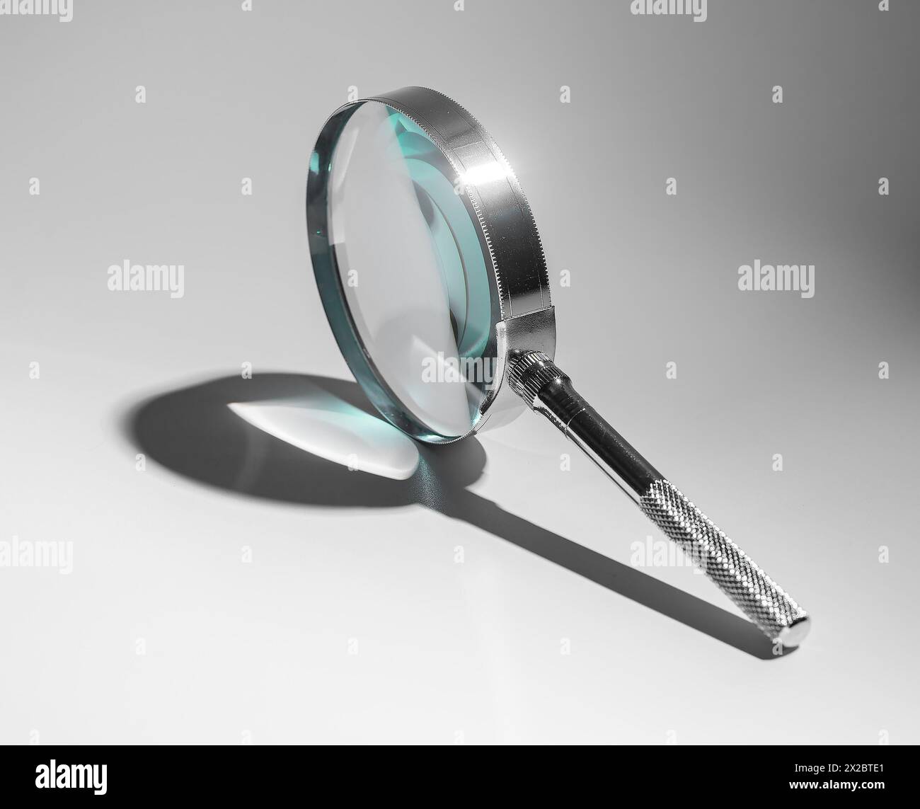 Abstract concept of scientific investigation. Silver metal handle ...