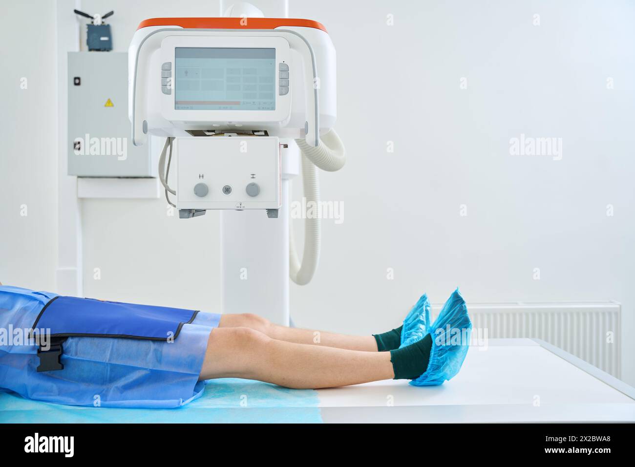 Patient is getting digital radiography of knee joints Stock Photo - Alamy