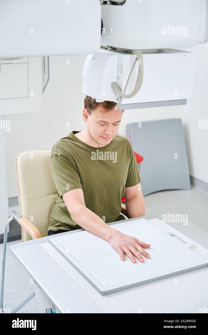 Adult patient is undergoing upper limb radiography Stock Photo - Alamy