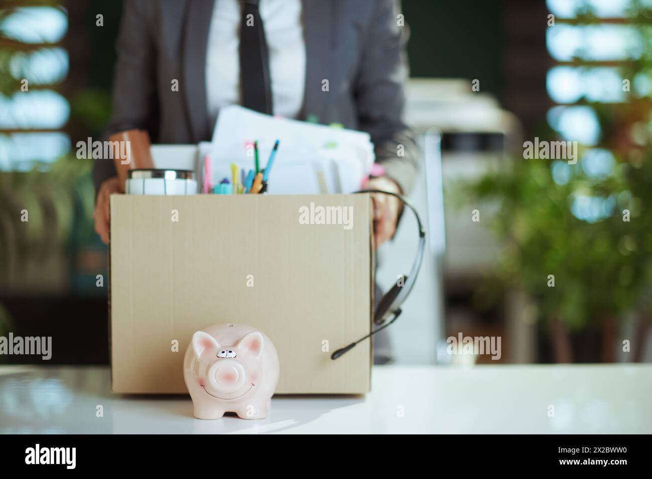 New job. Closeup on modern female employee in modern green office in ...