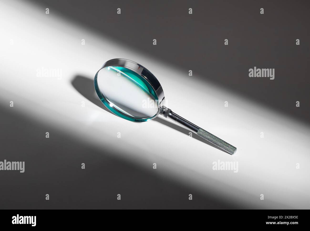 Glass lens magnifies, silver handle. Search concept, science object ...