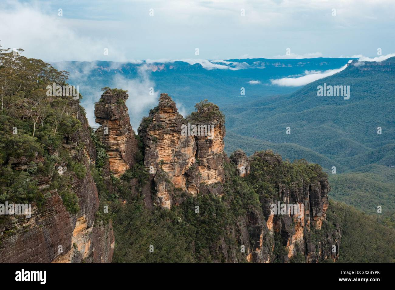 The legendary Three Sisters stand tall against a stunning backdrop of ...