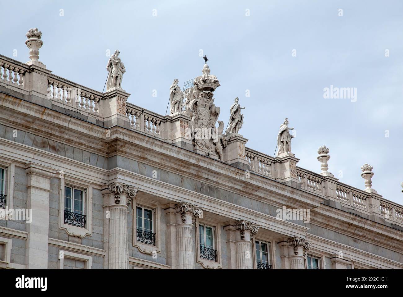 Scupltures atop the facade of Royal Palace of Madrid, the main ...