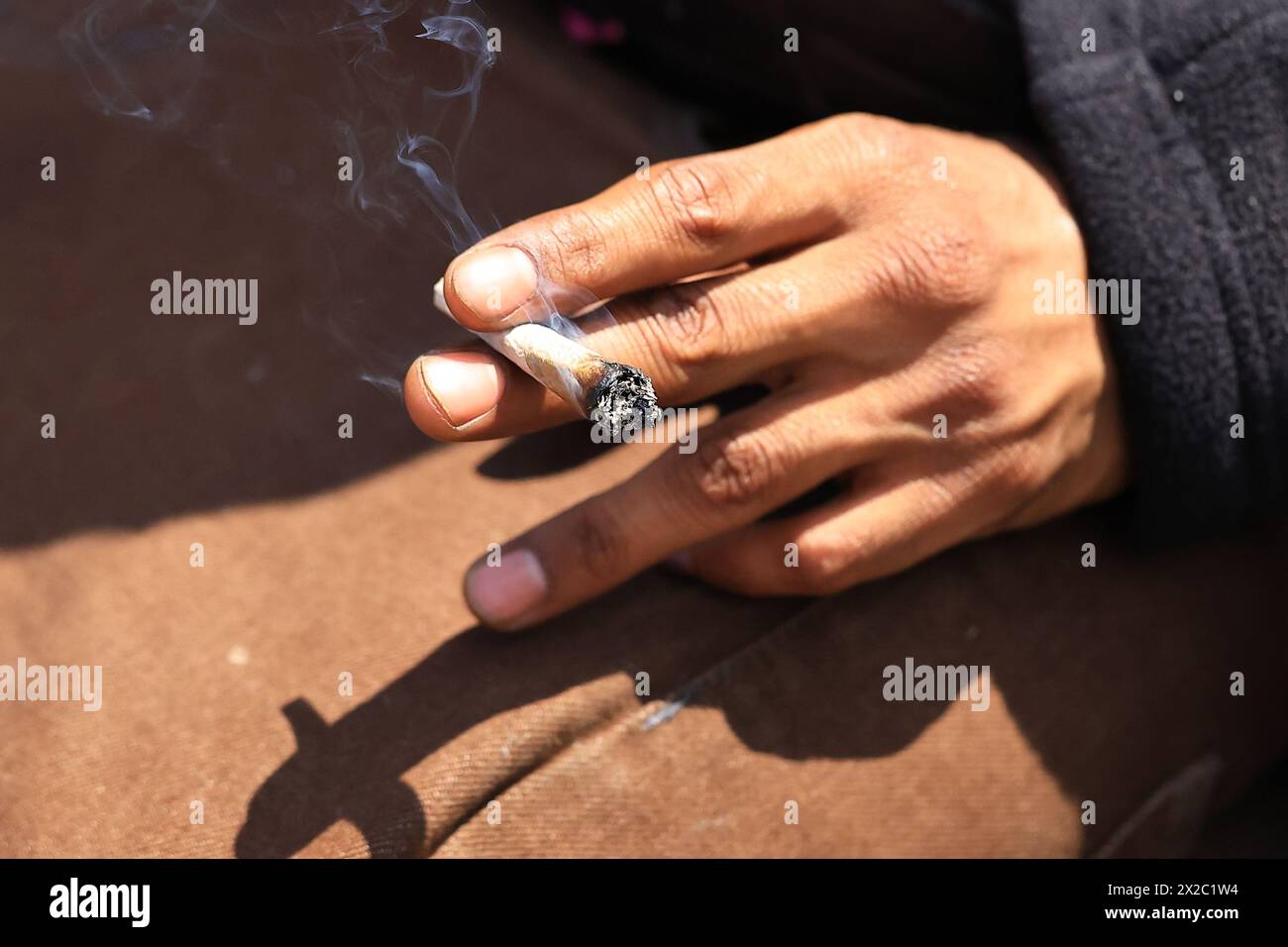 A man holds a joint while attending the 420 Festivities at Washington ...