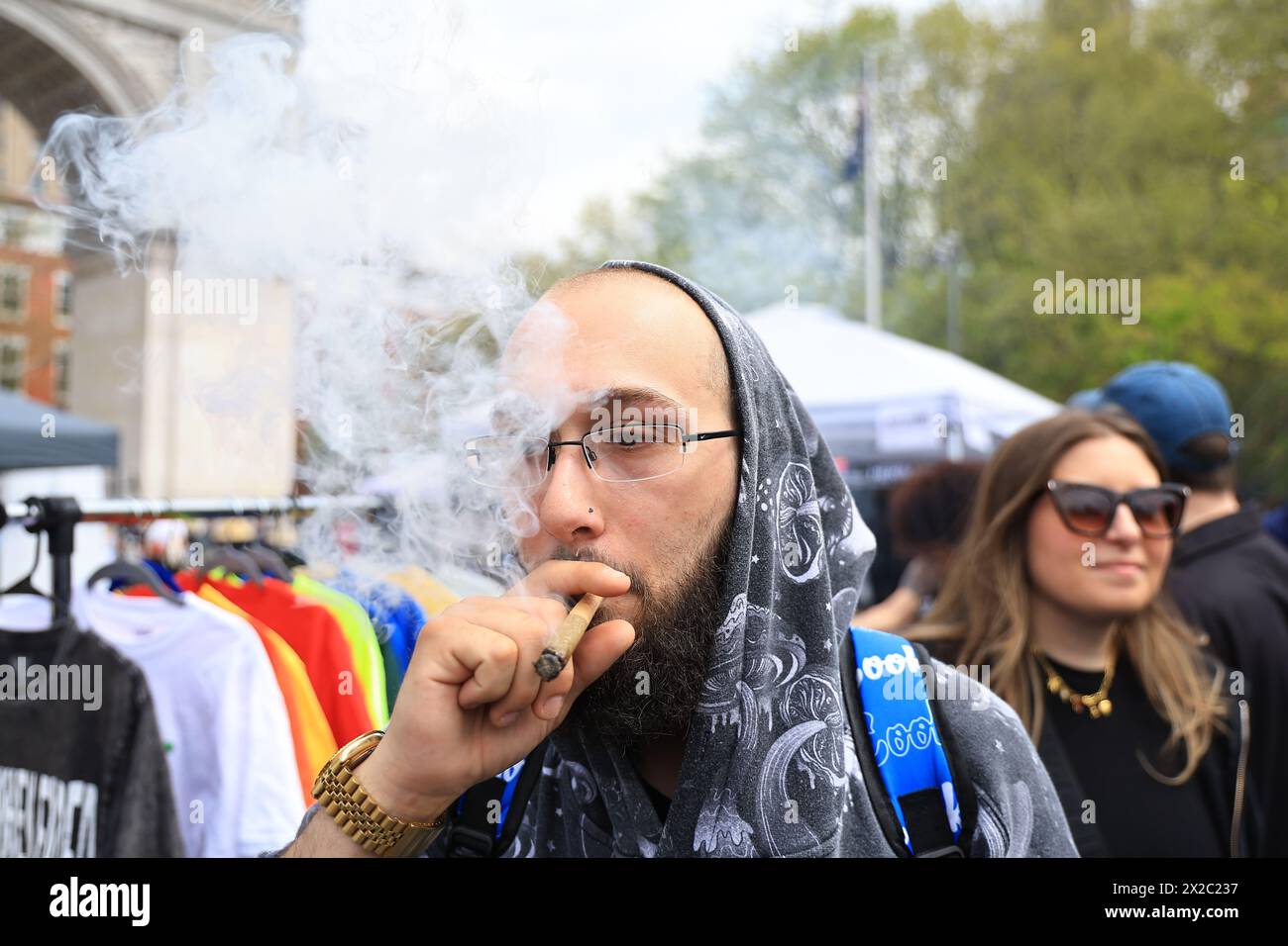 A man smokes a marijuana cigarette at the 420 Festivities at Washington ...