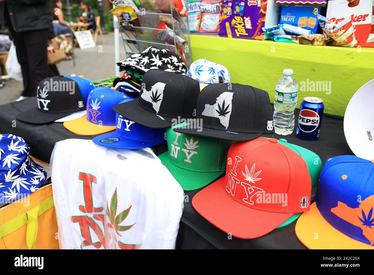 Caps and shirts are displayed for sale at the 420 Festivities at ...