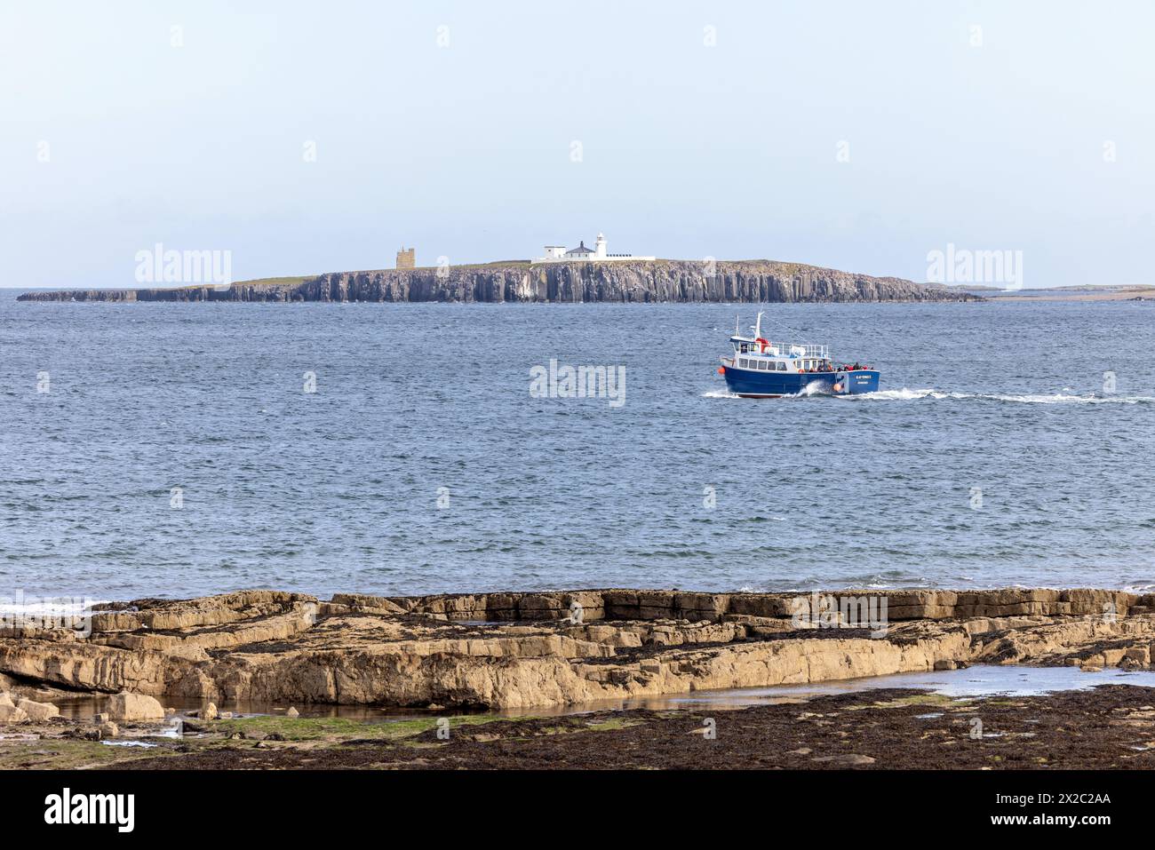 A sightseeing boat heads for the Farne Islands, off Northumberland ...