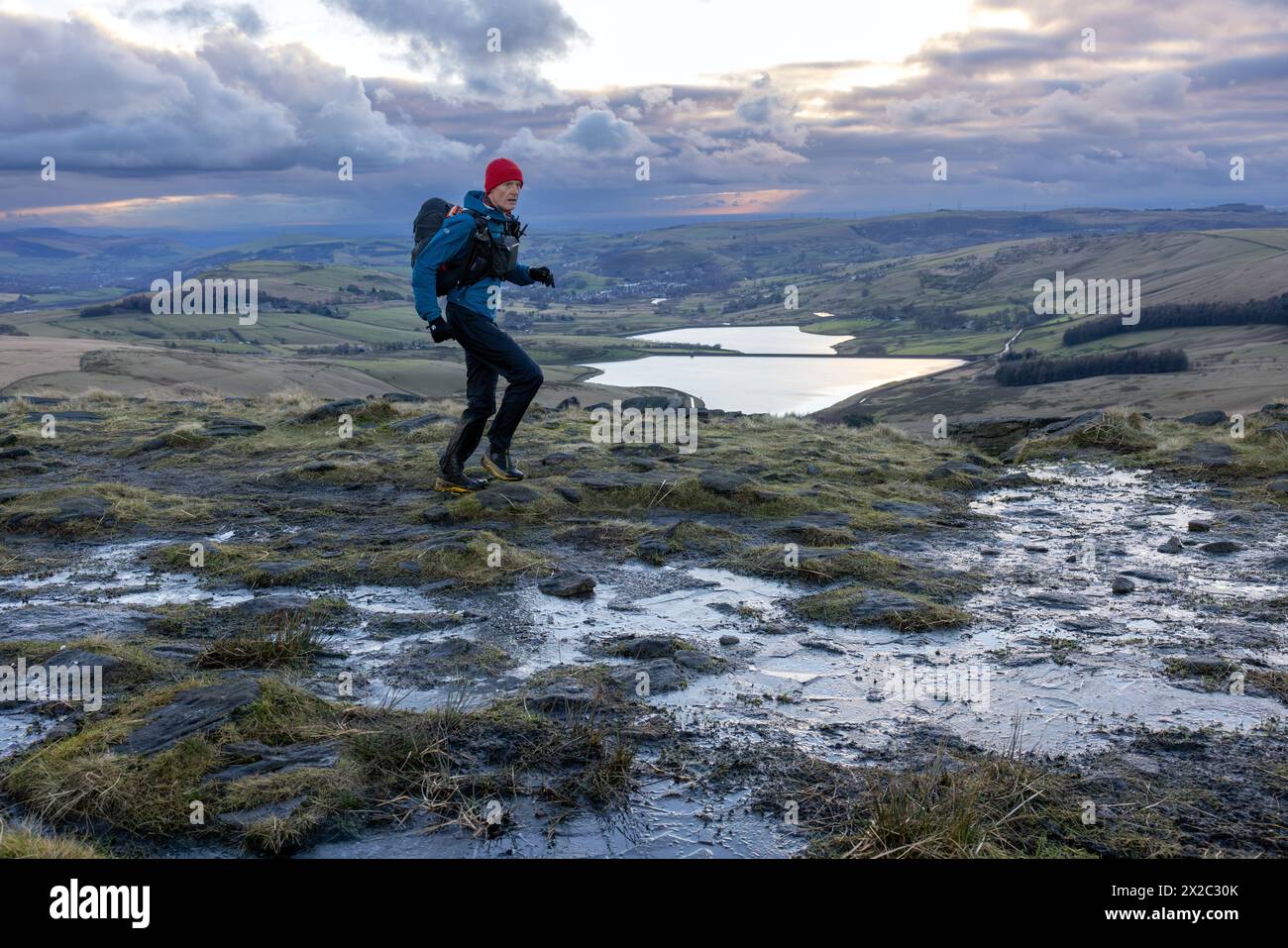 Alex Payne crosses Standedge during the 2024 winter Spine Race Stock ...