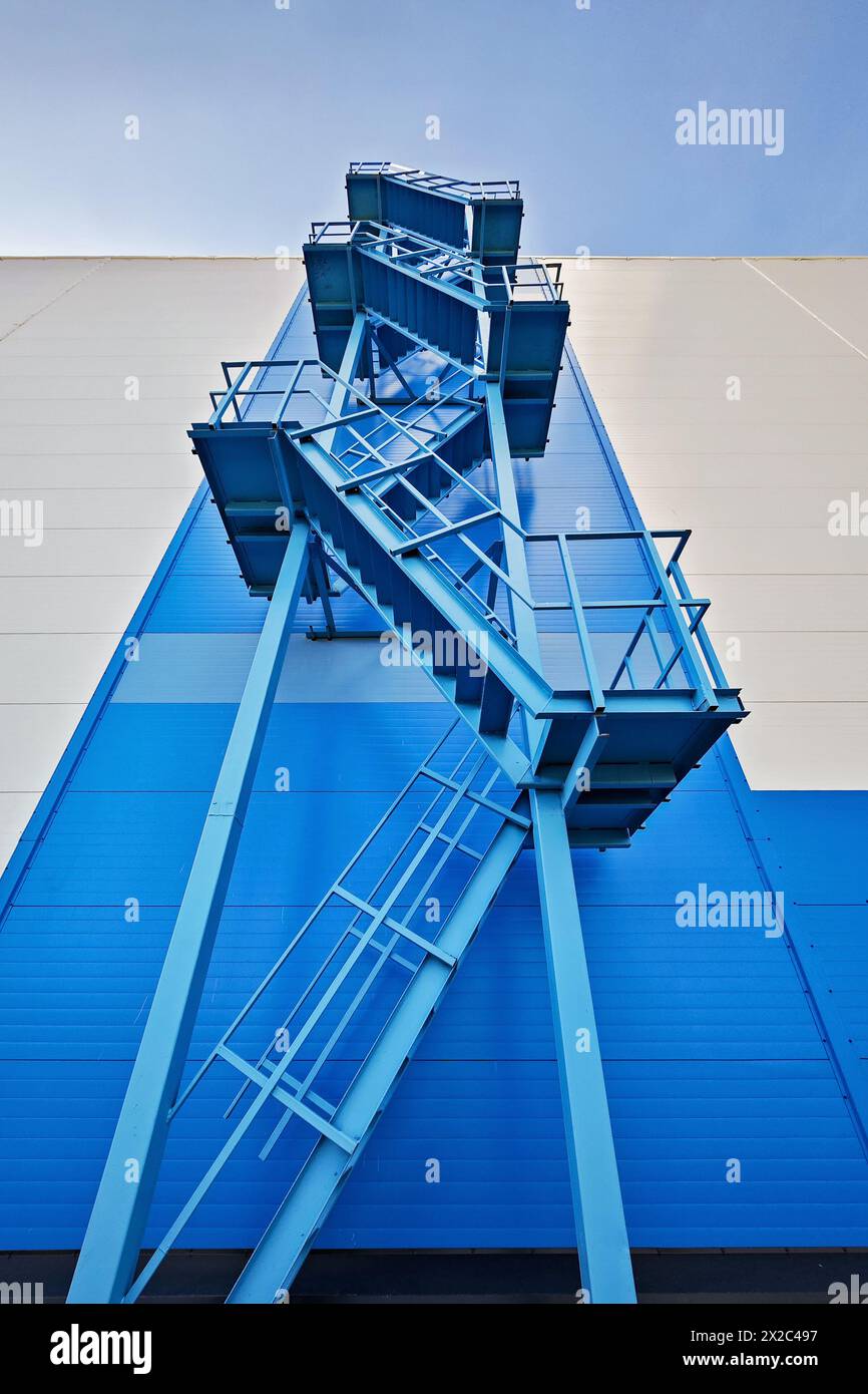 Emergency blue ladder on the wall of modern building Stock Photo - Alamy