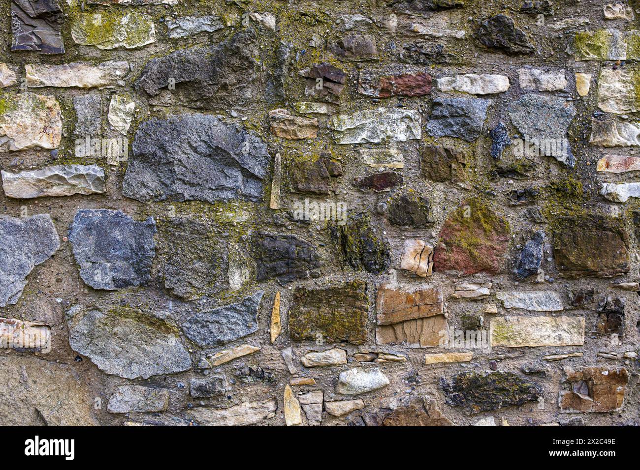 Stone cladding texture formed by old rustic stones and bricks ...