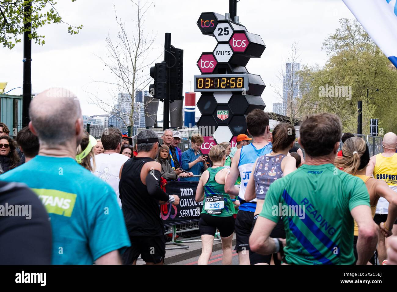 London, UK. 21st Apr, 2024. Runners pass through a checkpoint entering ...