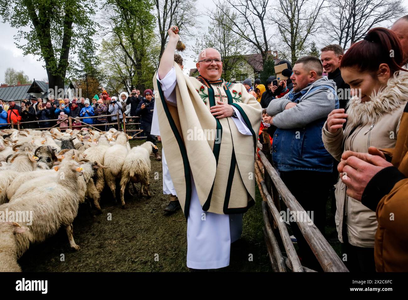 A priest blesses sheep and people as grazing season begins with ...