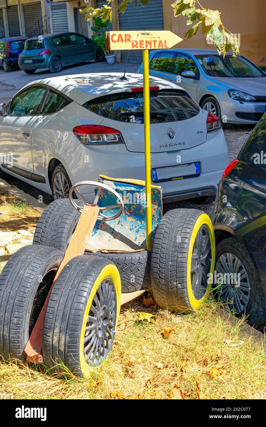 Car rental location indicator sign depicting a handcrafted car in the ...