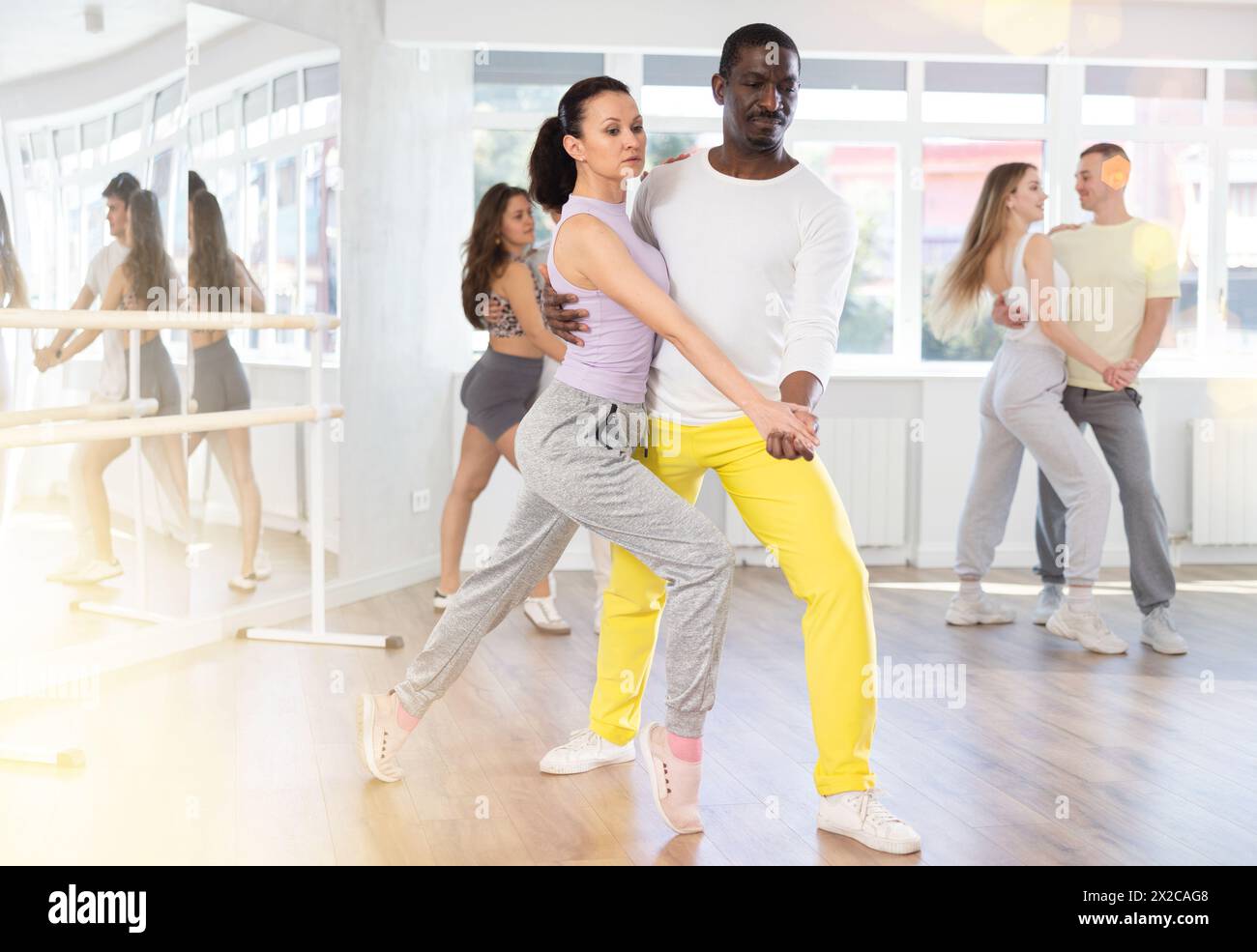 Woman dances incendiary tango with African man partner during ...