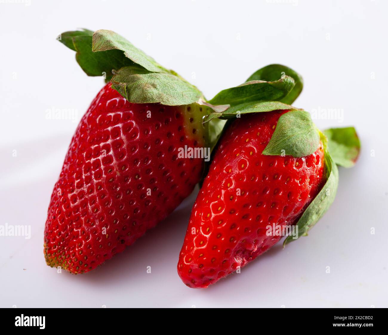 Large ripe bright red strawberries lie on white background Stock Photo ...
