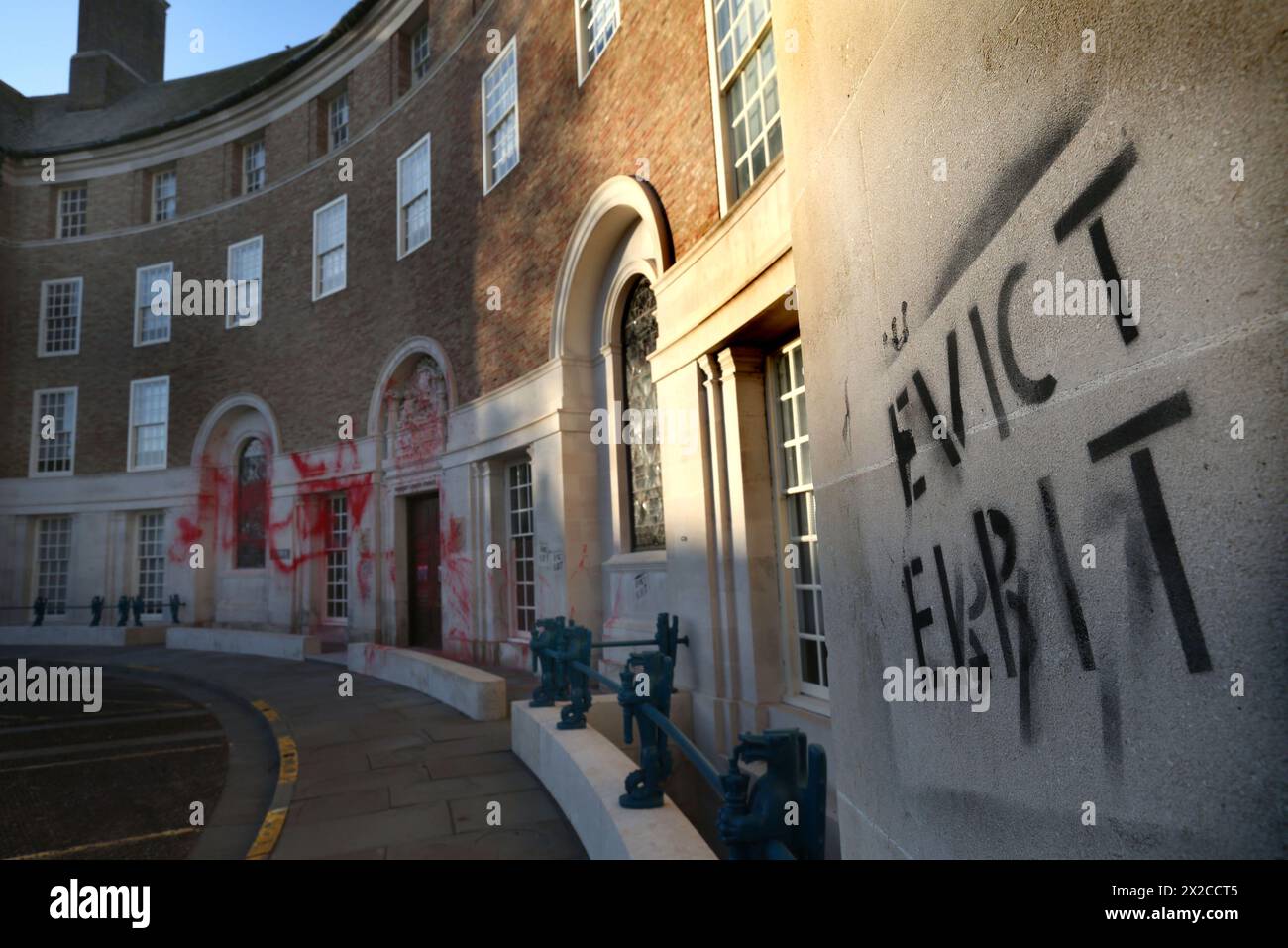 Red paint coats the walls and front door of County Hall and the words ...