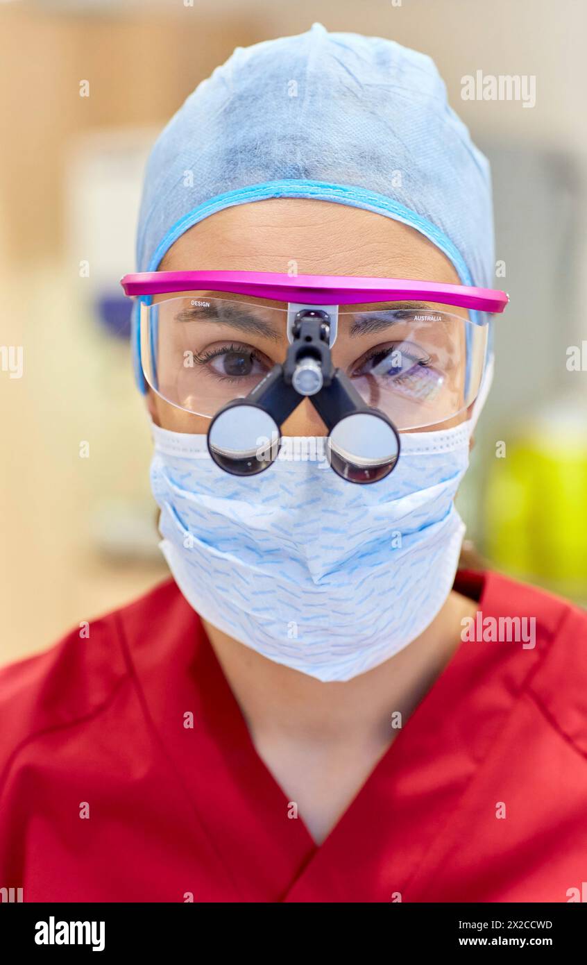 Surgeon with magnifying glasses. Surgical glasses. Plastic surgery ...
