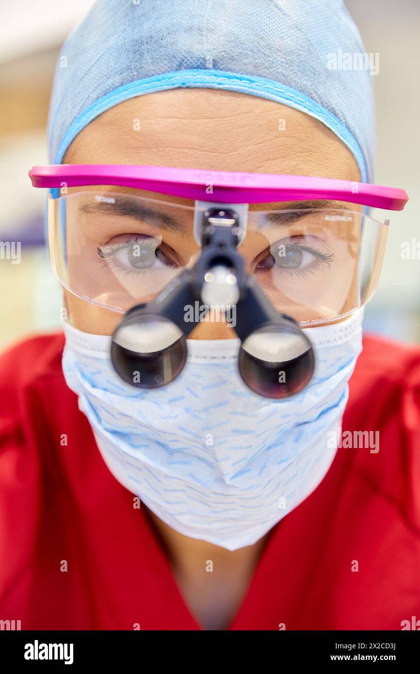 Surgeon with magnifying glasses. Surgical glasses. Plastic surgery ...