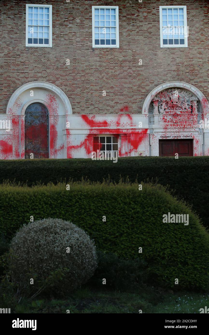 Red paint coats the walls and front door of County Hall viewed across ...