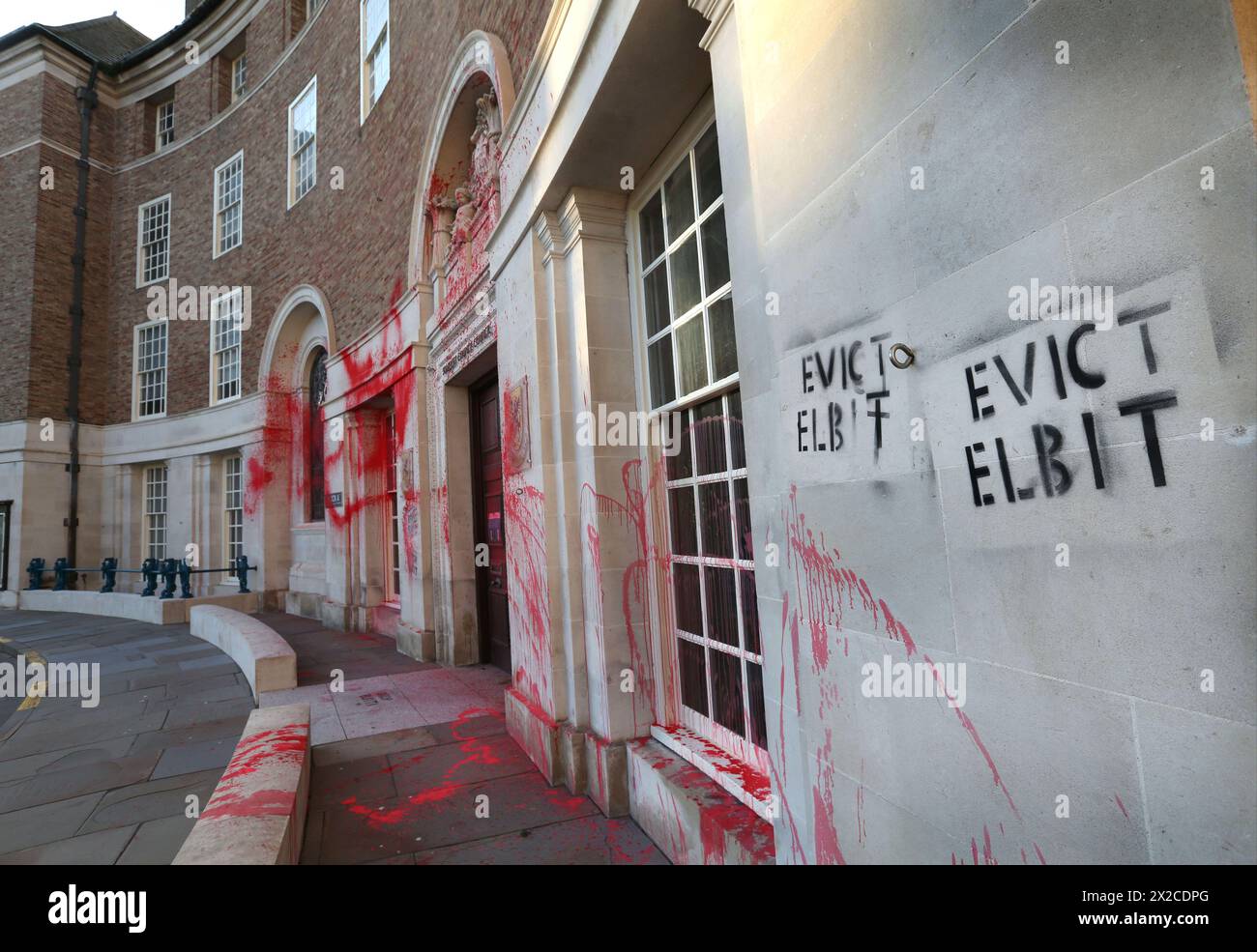 Red paint coats the walls and front door of County Hall and the words ...