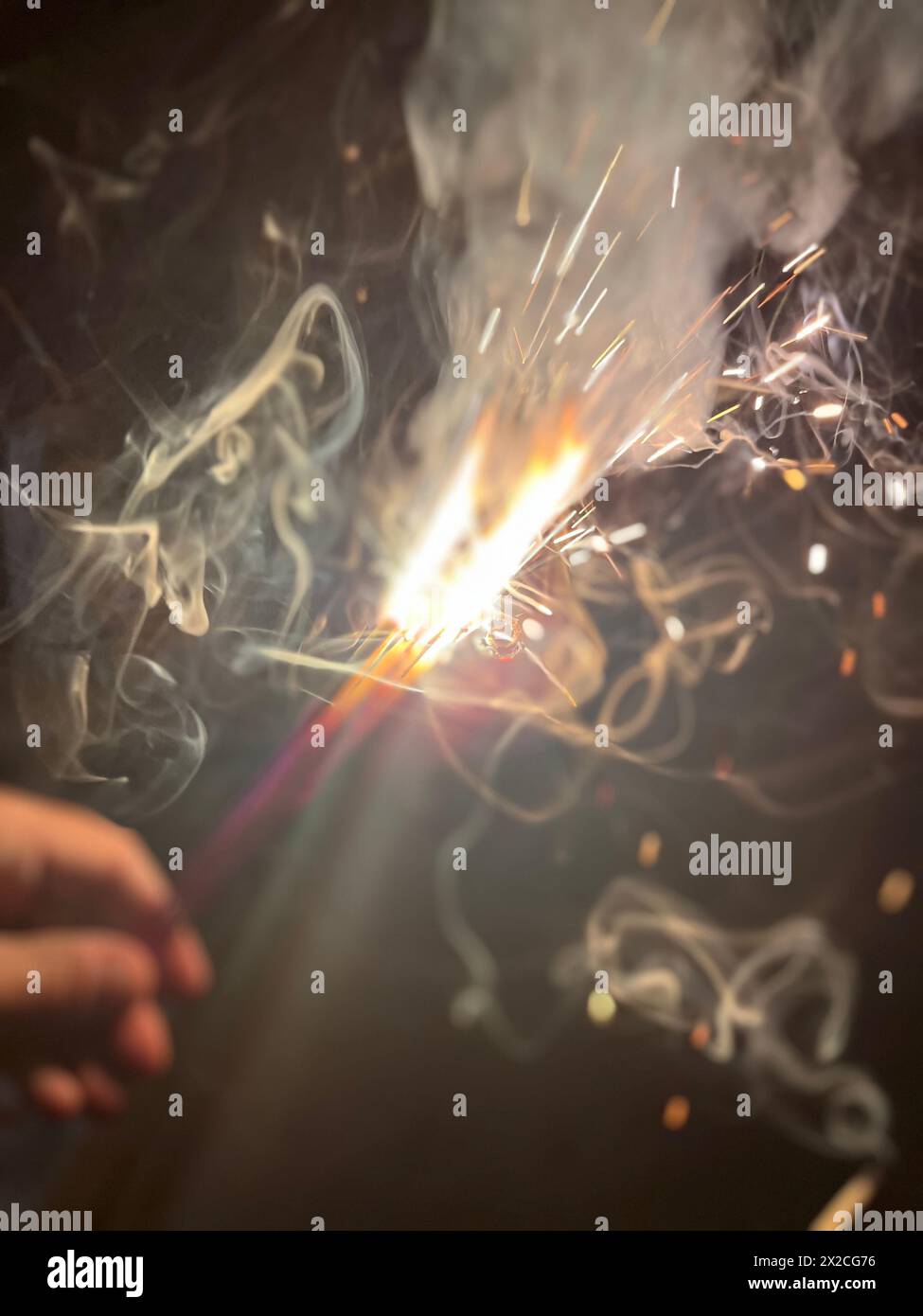 sparkler firework shooting sparks and smoke on the Fourth of July Stock ...